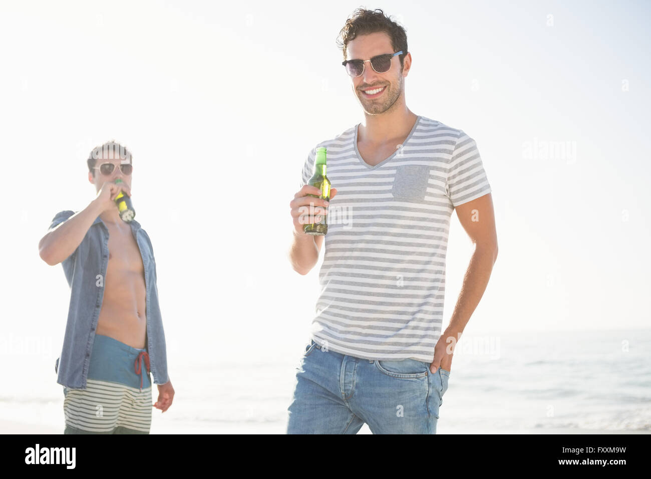 Man drinking alcohol not woman beach hi-res stock photography and ...
