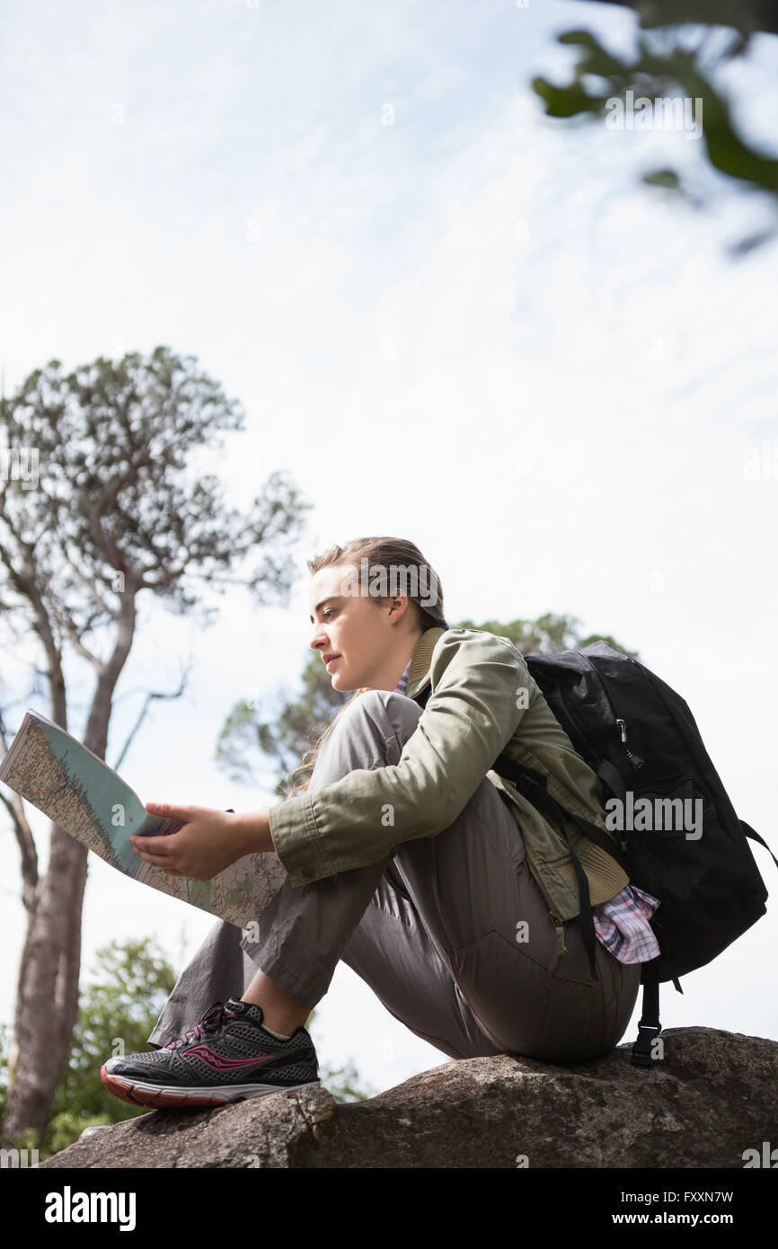 Woman checking the map Stock Photo - Alamy