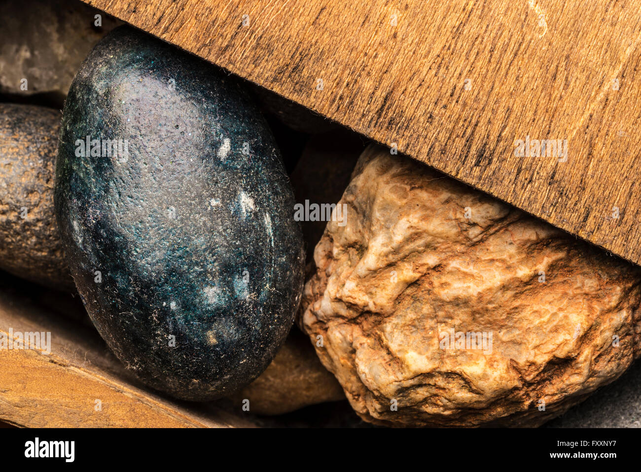 Close-up of stones inside an old wooden box as background Stock Photo ...