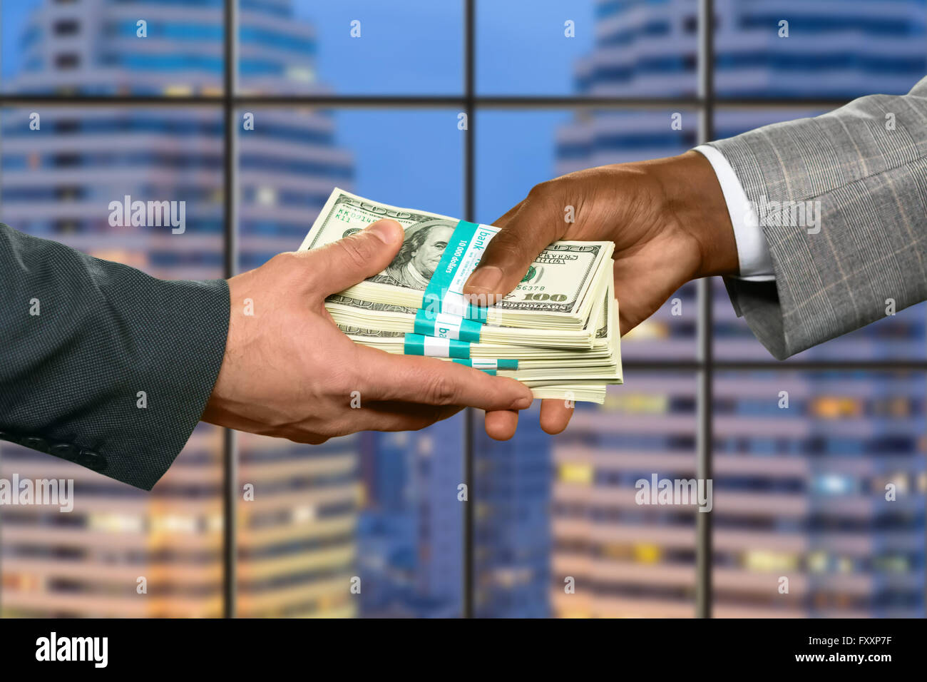 Businessman's hand taking big money Stock Photo - Alamy