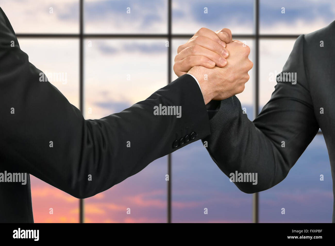 Strong handshake of businessmen Stock Photo - Alamy
