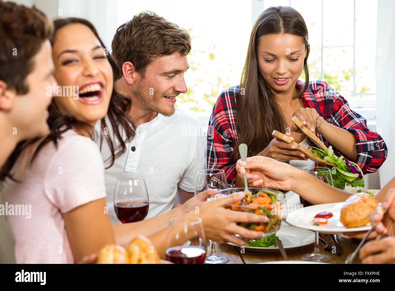 Group of friends having meal Stock Photo - Alamy