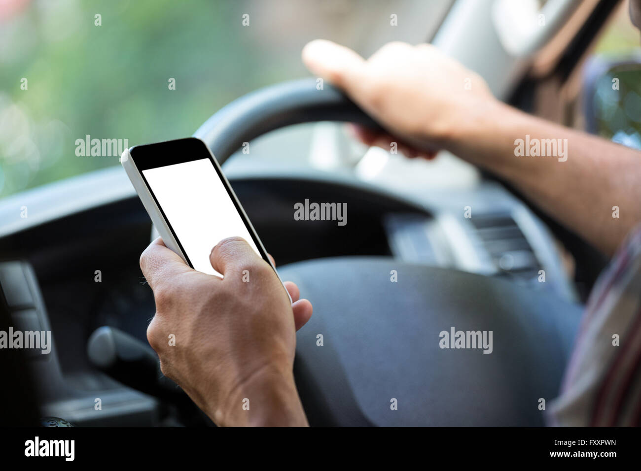 Man using mobile phone while driving Stock Photo - Alamy