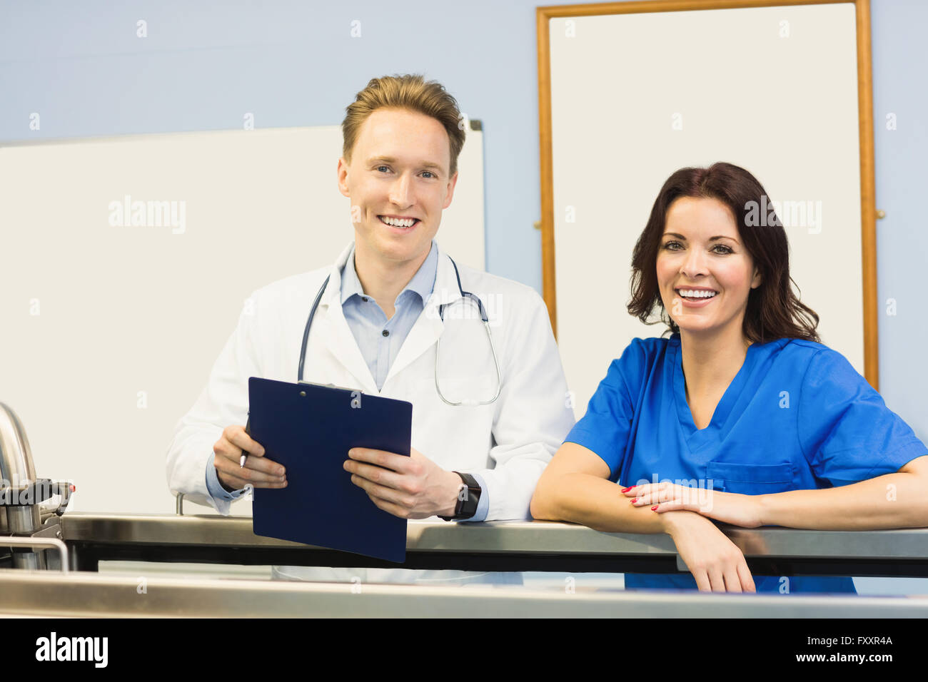 Portrait happy veterinarian clipboard hi-res stock photography and ...