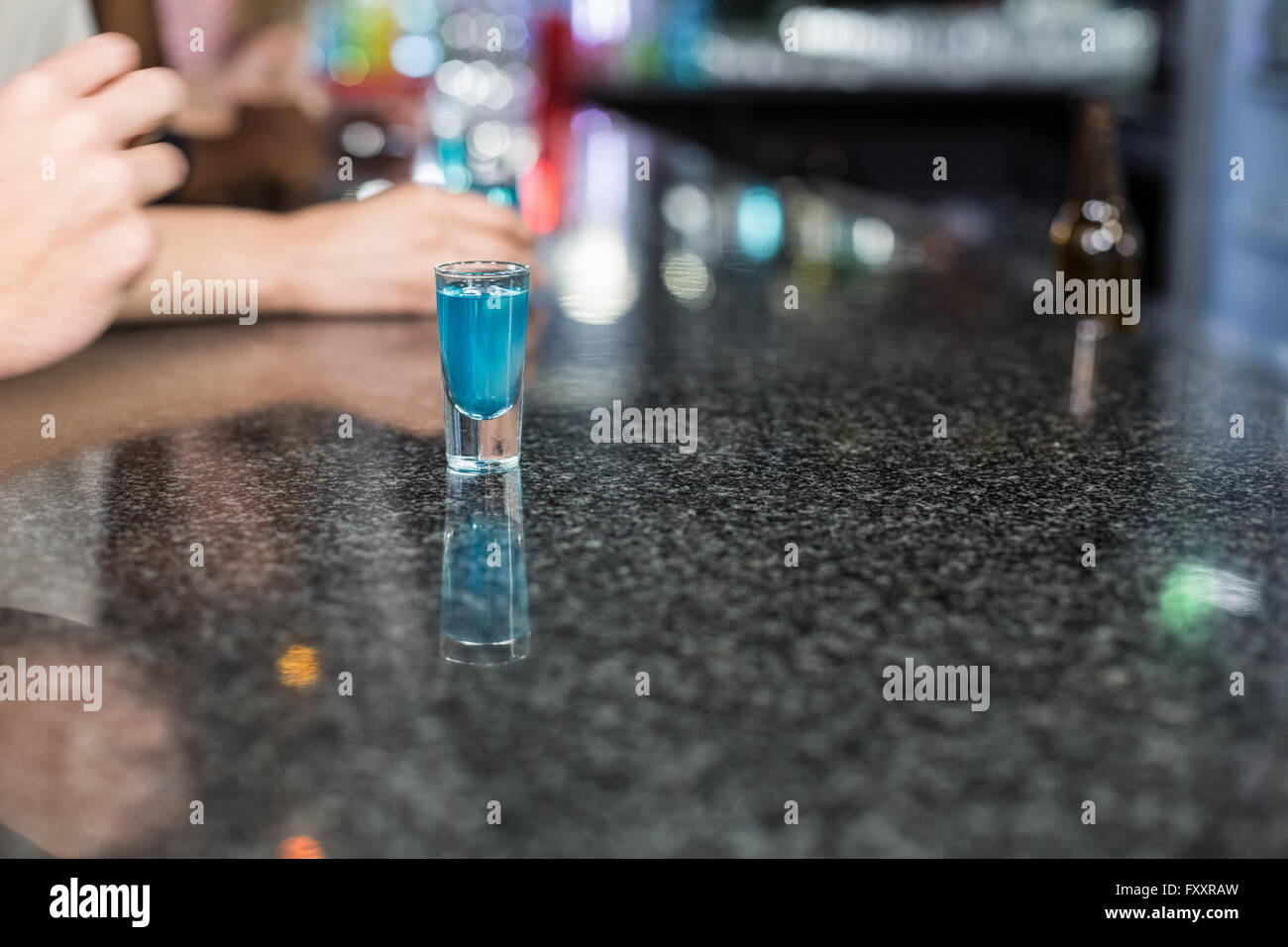 Blue shot on a counter Stock Photo - Alamy