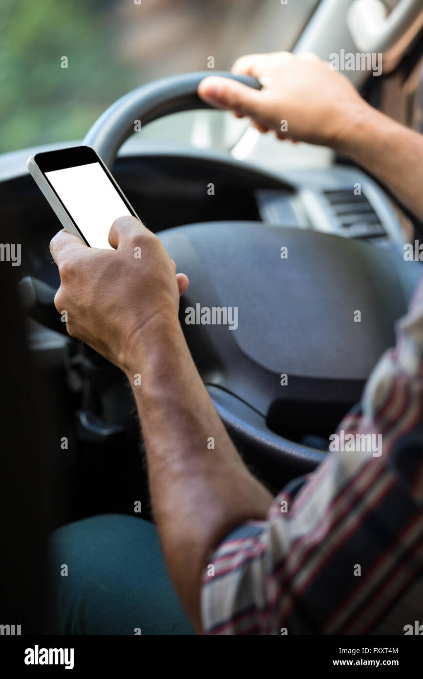 Man using mobile phone while driving Stock Photo - Alamy