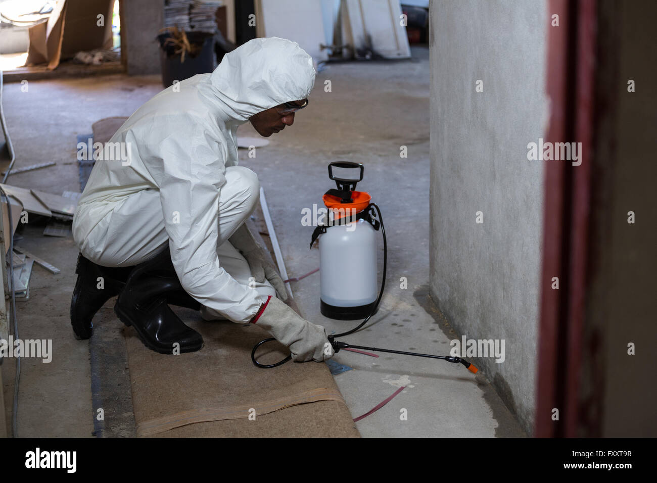 Man kneeling doing diy hi-res stock photography and images - Alamy