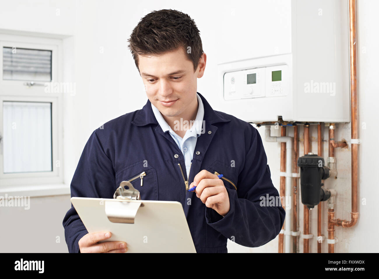 Man boiler repairing hi-res stock photography and images - Alamy