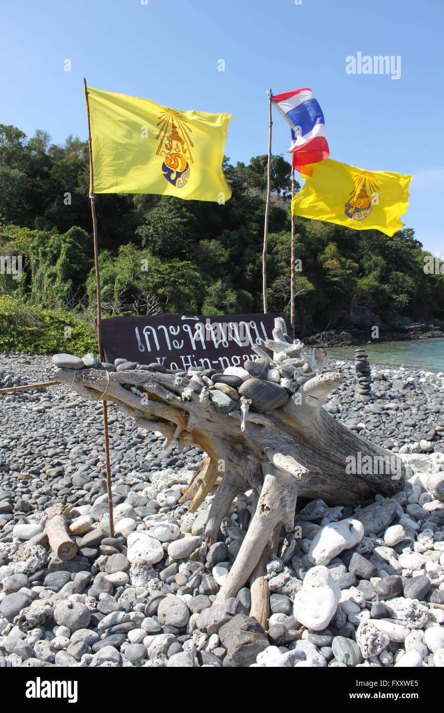 Flags on a deserted Thai island of Koh Hin Stock Photo - Alamy
