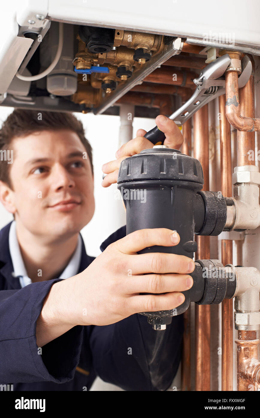 Male Plumber Working On Central Heating Boiler Stock Photo - Alamy