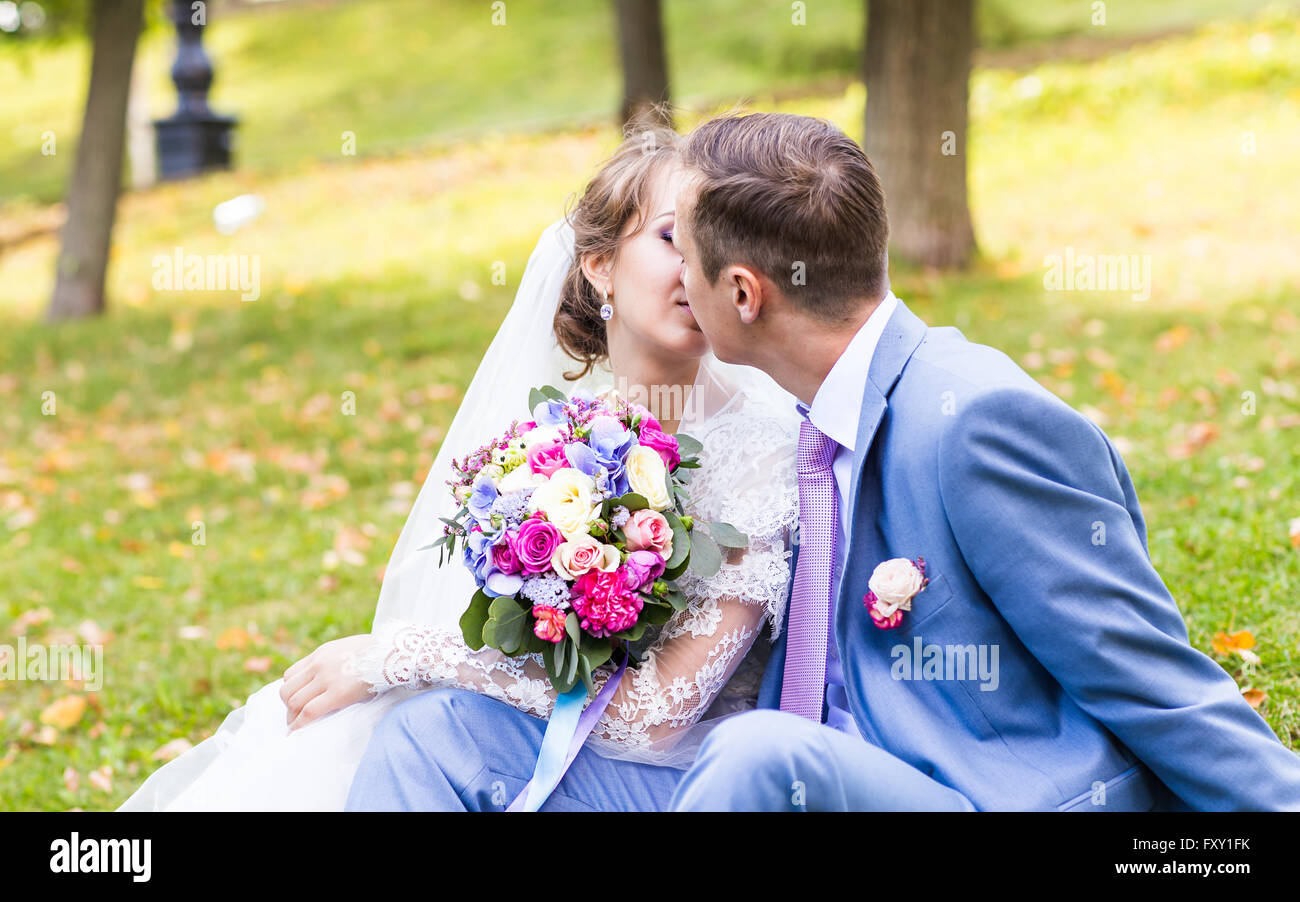 Beautiful Romantic Bride with Groom Kissing and Embracing Outdoors ...