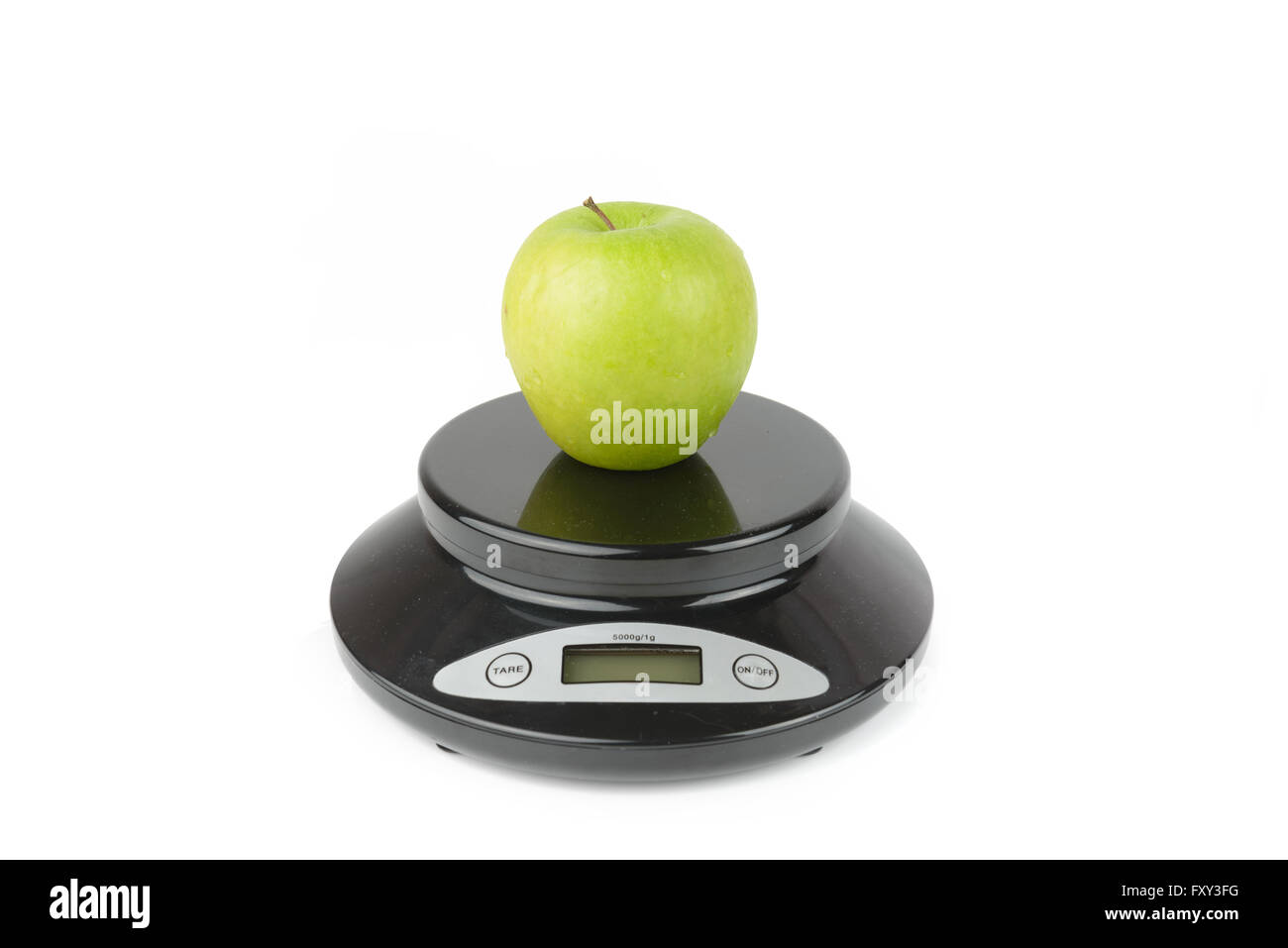 Black digital scale on isolate white background, with green apple Stock ...
