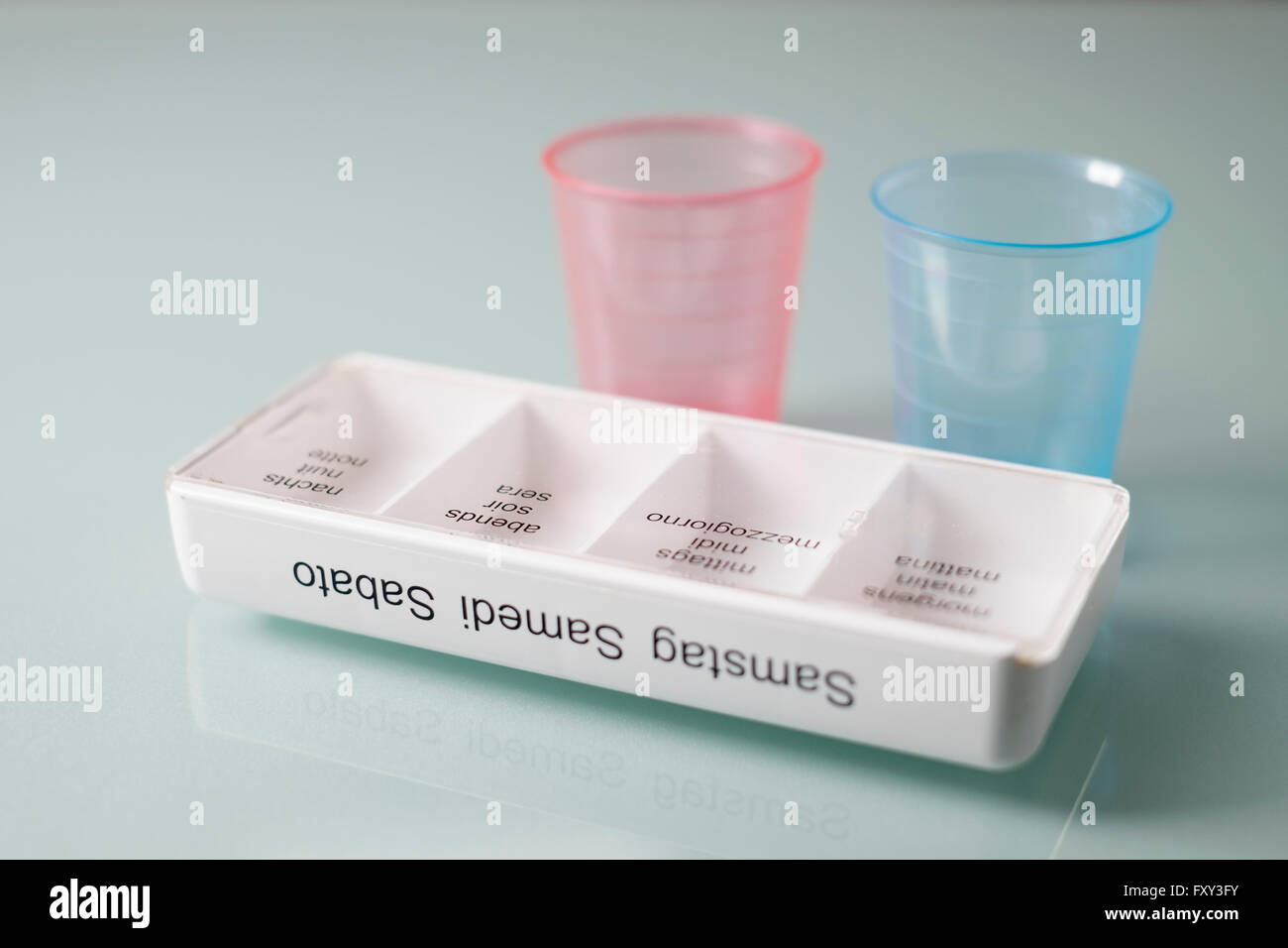 Dispensing cups and daily dose dish Stock Photo - Alamy