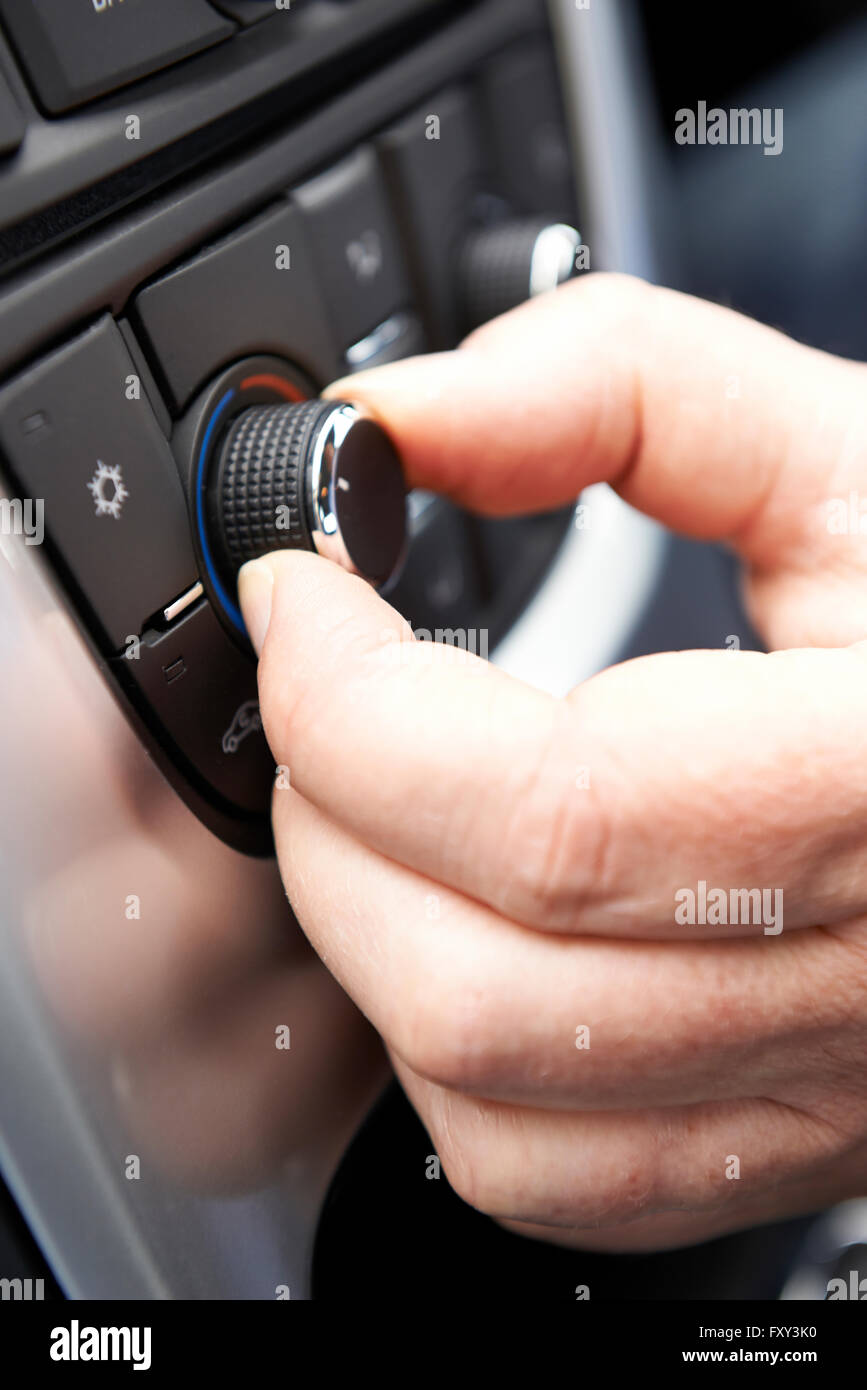 Close Up Of Hand Adjusting Car Air Conditioning Control On Dashboard ...
