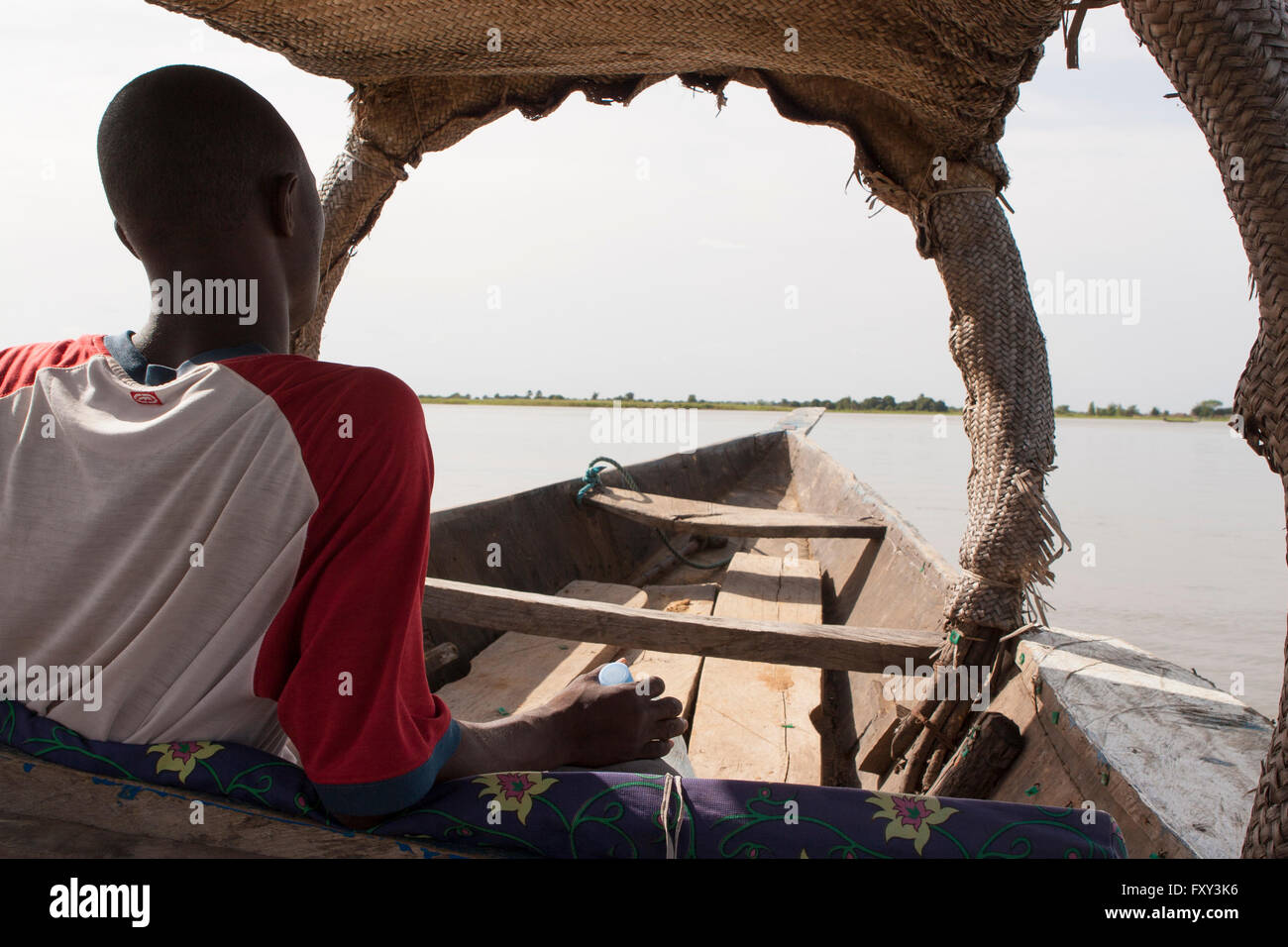 African boy on a pirogue on River Niger Stock Photo - Alamy