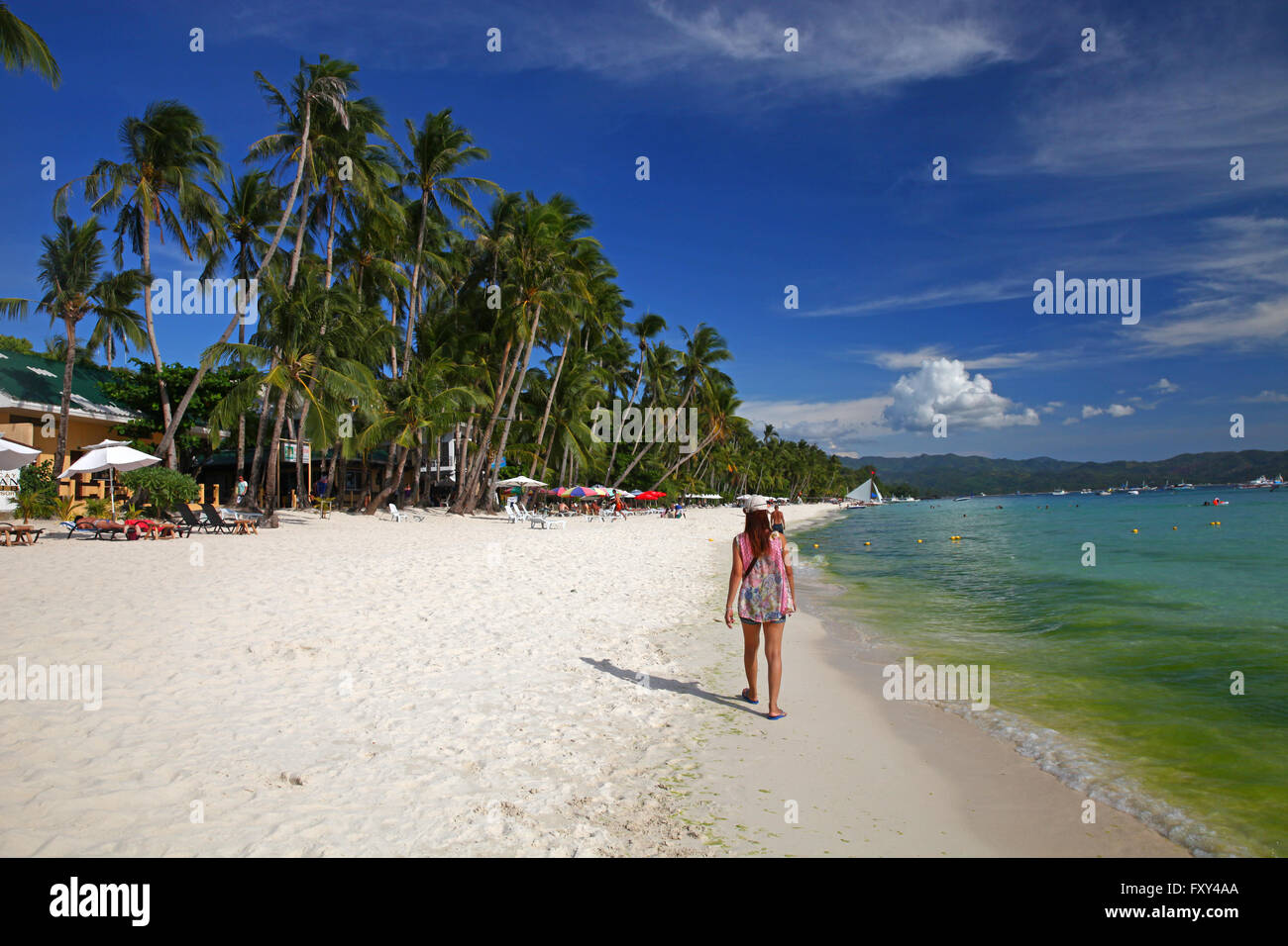 WOMAN WALKS ON WHITE BEACH BORACAY PHILIPPINES 28 April 2015 Stock ...