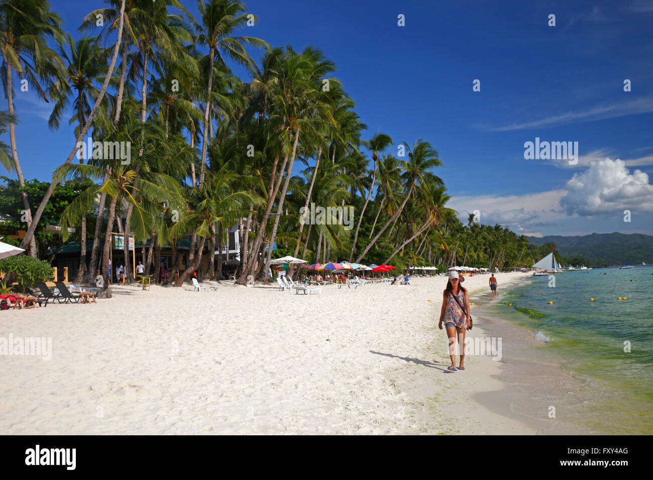WOMAN WALKS ON WHITE BEACH BORACAY PHILIPPINES 28 April 2015 Stock ...