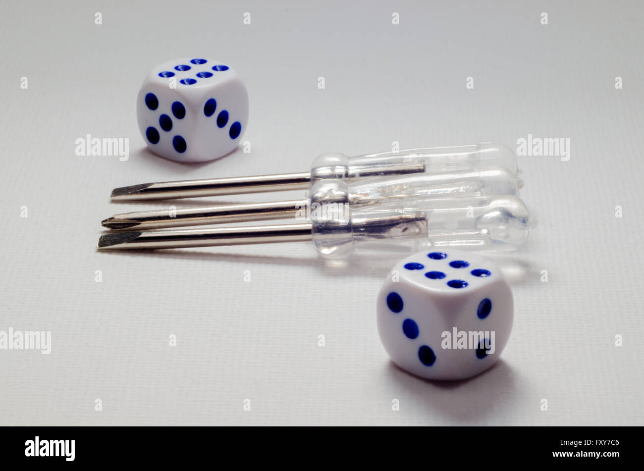 A Studio Photograph of a Set of Screwdrivers and Two Dice - Both ...