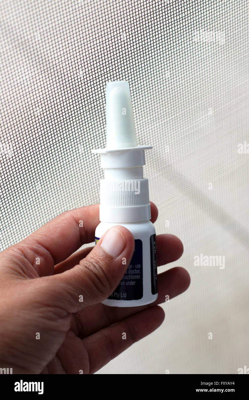 Close up image of hand holding nasal spray Stock Photo - Alamy
