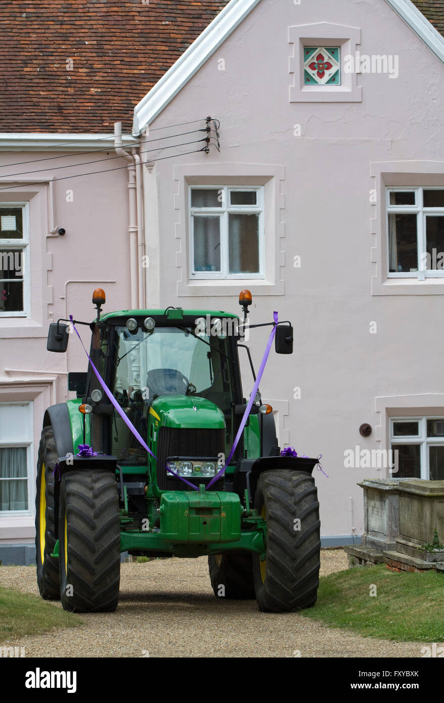 Large modern green tractor decorated with ribbons for a wedding Stock ...
