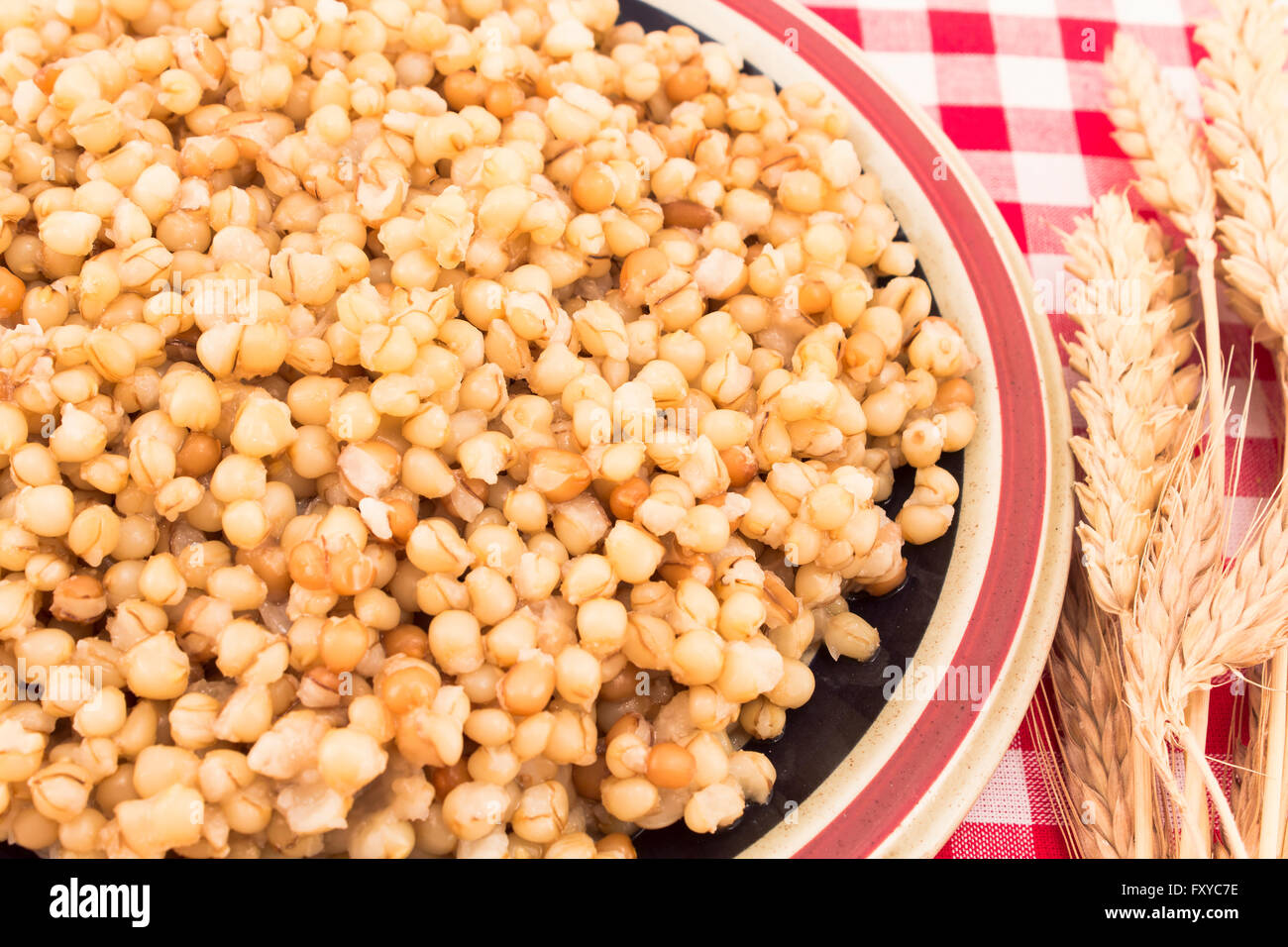 Cooked wheat and ear of wheat Stock Photo - Alamy