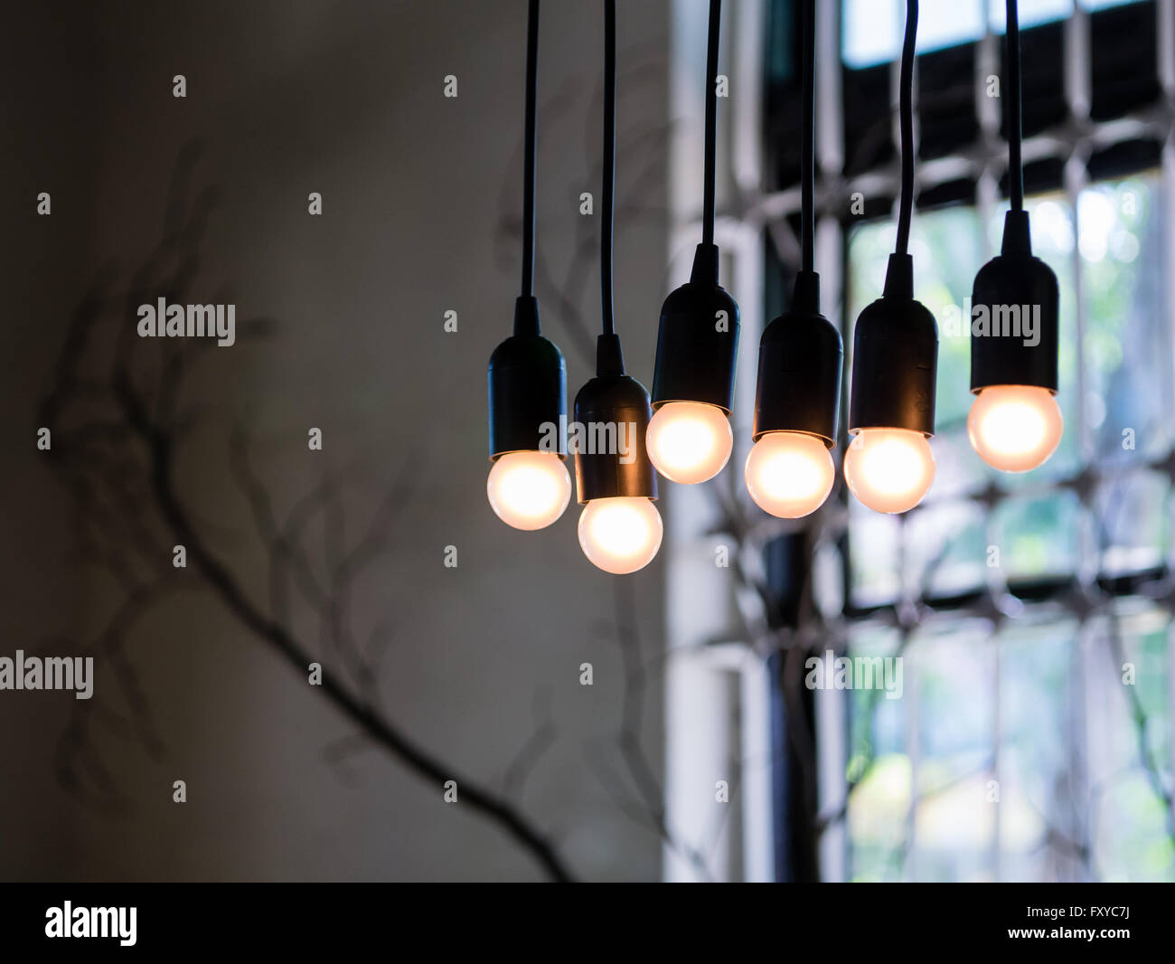 Several turn on light bulb hanging there Stock Photo - Alamy