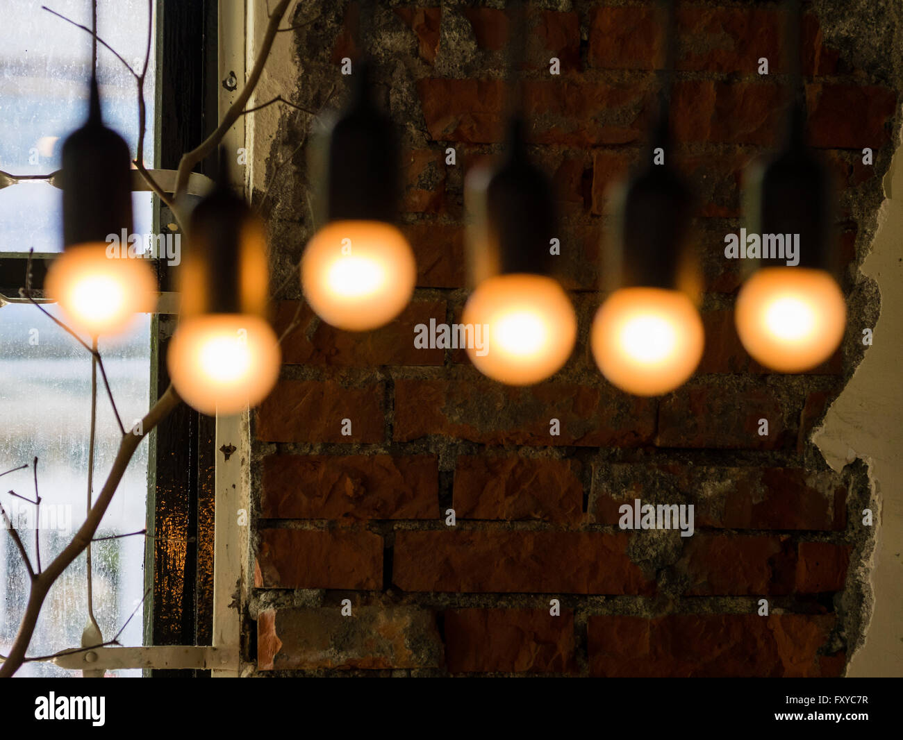 Several turn on light bulb hanging there Stock Photo - Alamy