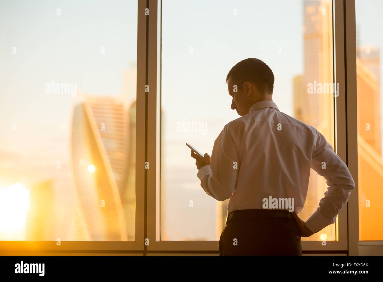 Back pose smart young guy hi-res stock photography and images - Alamy