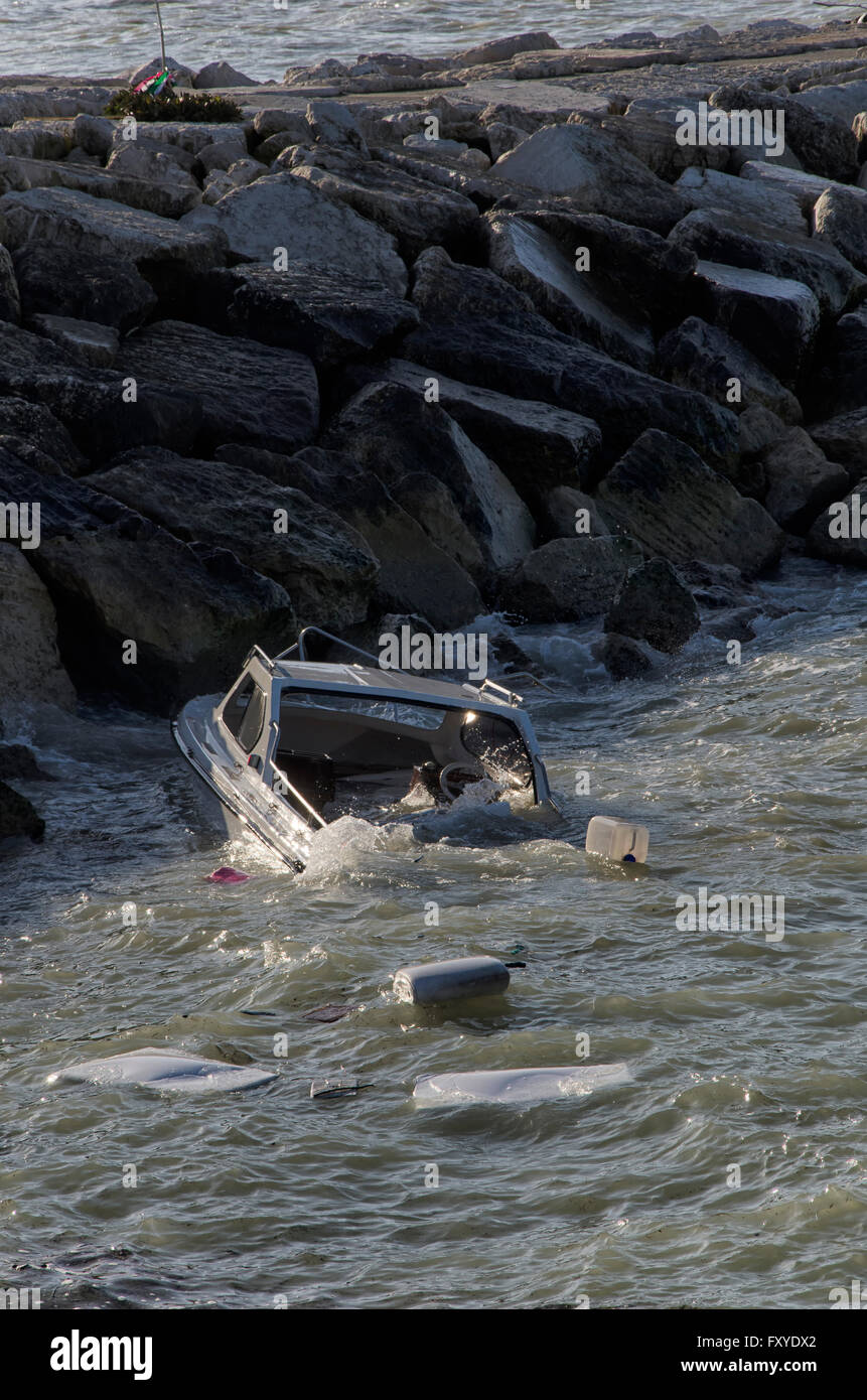 Sinking of a boat in front of the cliff Stock Photo - Alamy