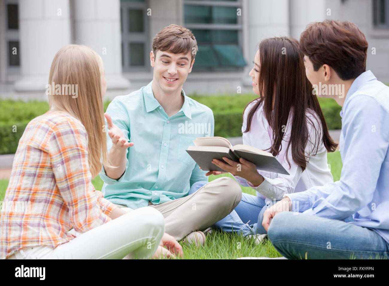 Domestic students and internationals students in college seated on a ...