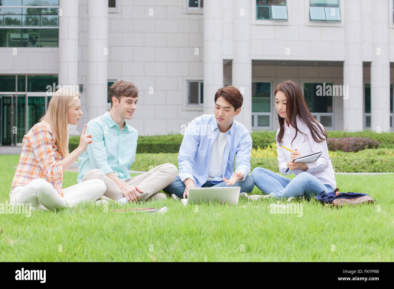 Domestic students and internationals students in college seated on a ...