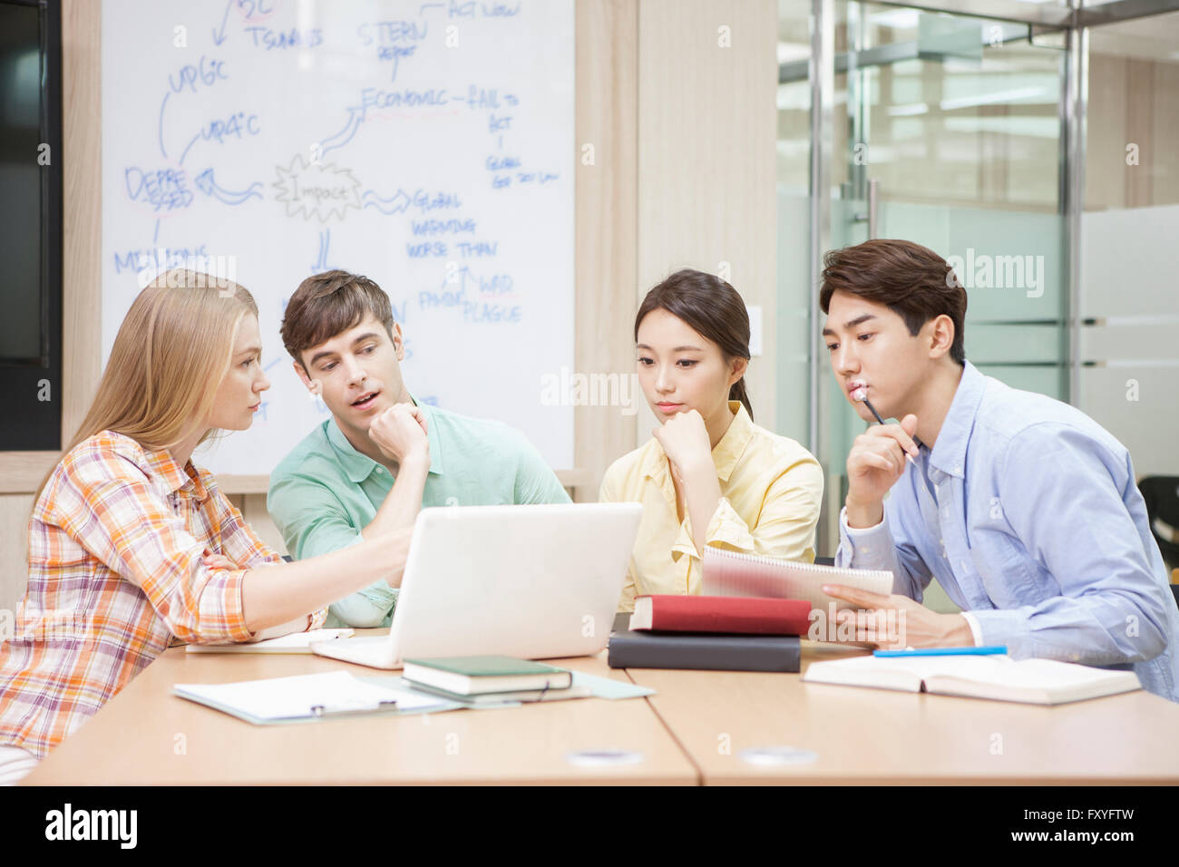 Domestic students and international student in college having a ...