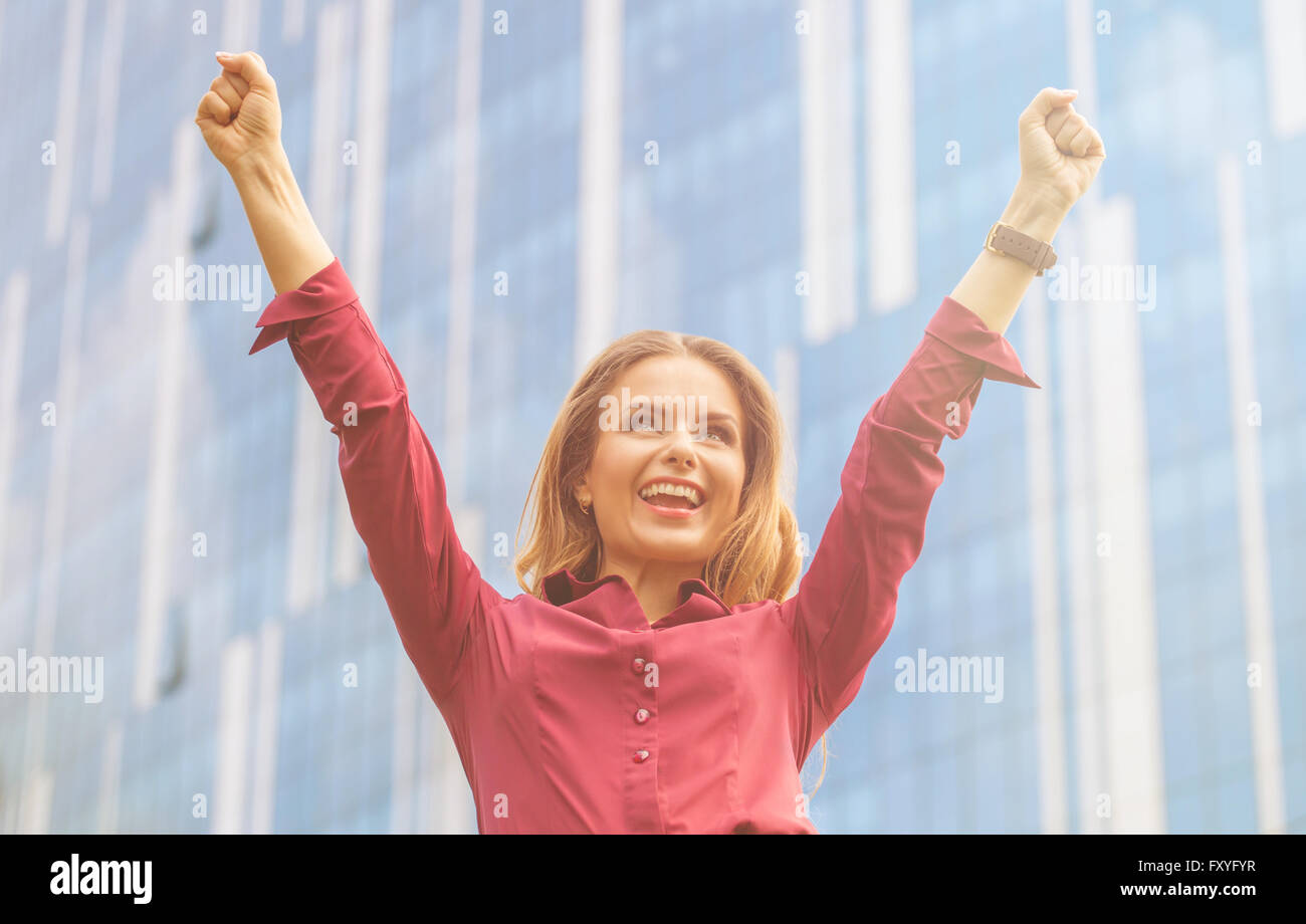 Businesswoman celebrating victory Stock Photo - Alamy