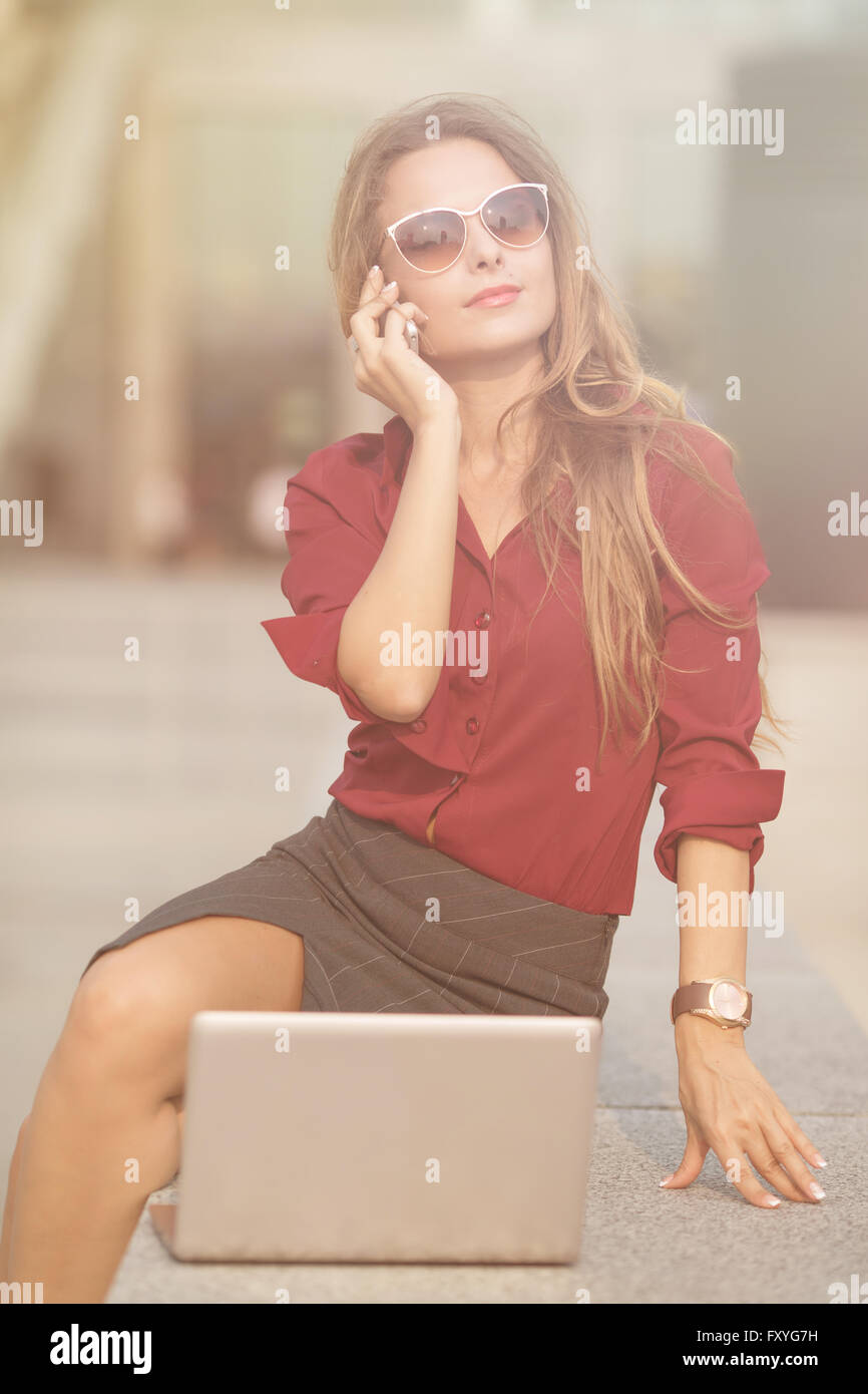 Businesswoman calling over the phone Stock Photo - Alamy