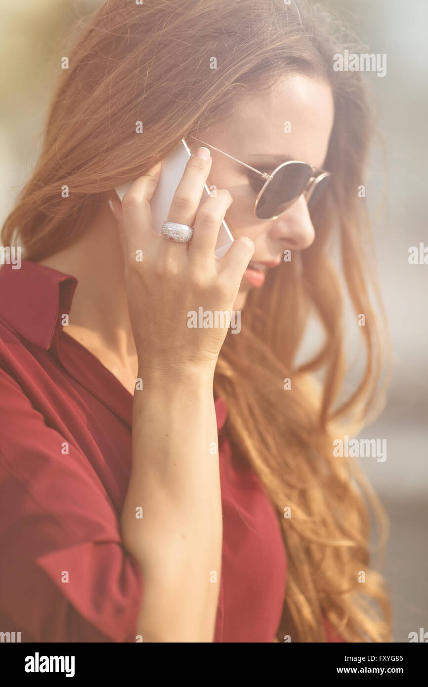 Businesswoman calling over the phone Stock Photo - Alamy