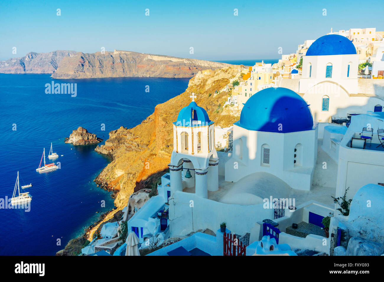 Blue dome churches in Oia at morning, Santorini, Greece Stock Photo - Alamy