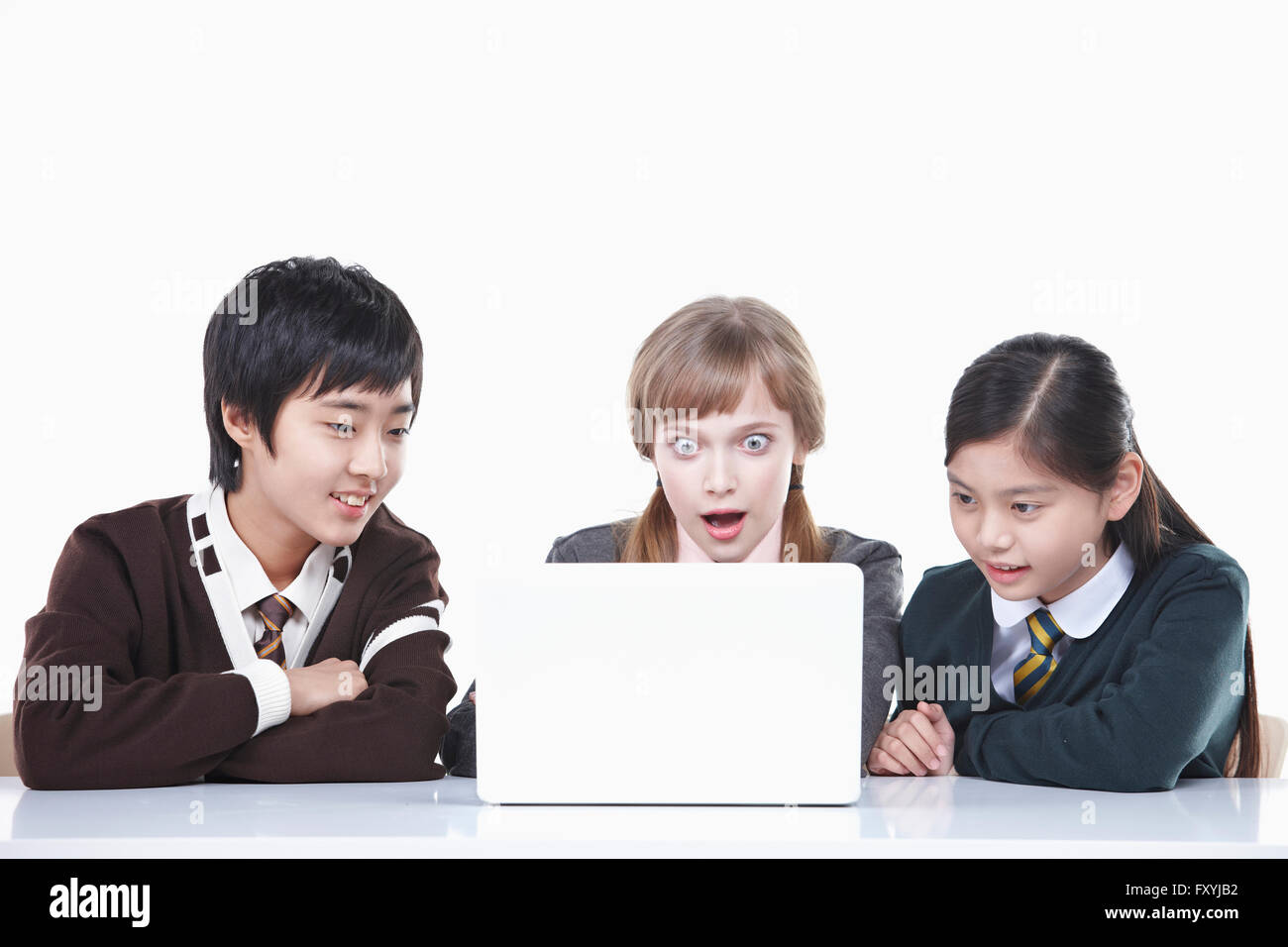 Three students from different countries in school uniform seated at ...