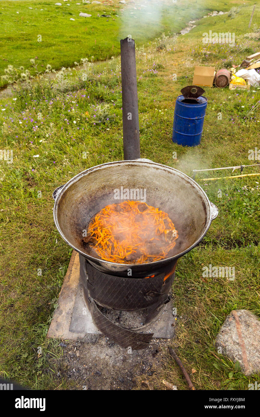 Cooking in Vintage Large Pan Stock Photo - Alamy