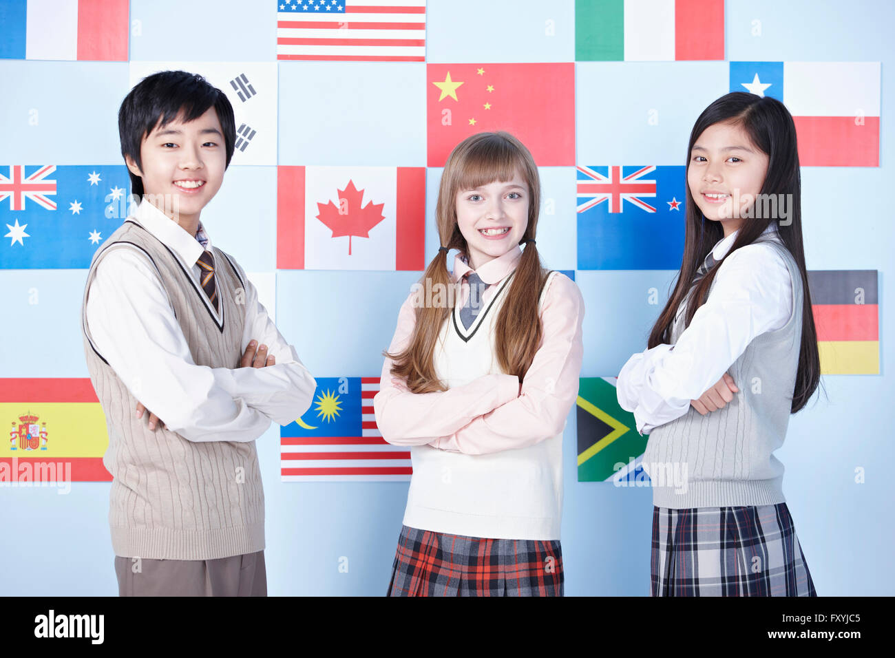 Three students from different countries with their arms folded by the ...