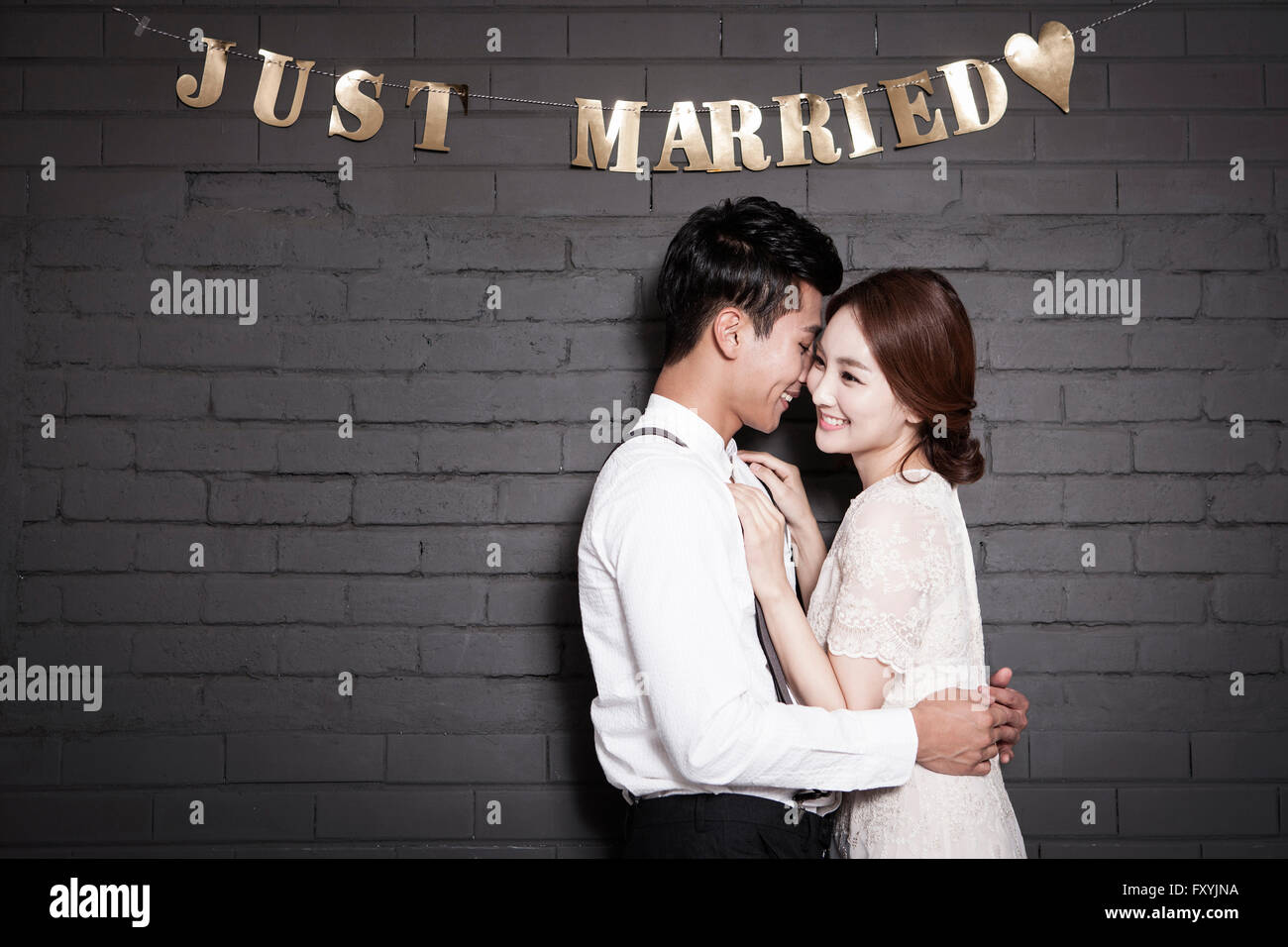 Young married couple hugging other hi-res stock photography and images ...