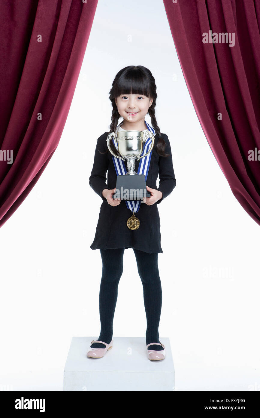 Girl holding trophy hi-res stock photography and images - Alamy
