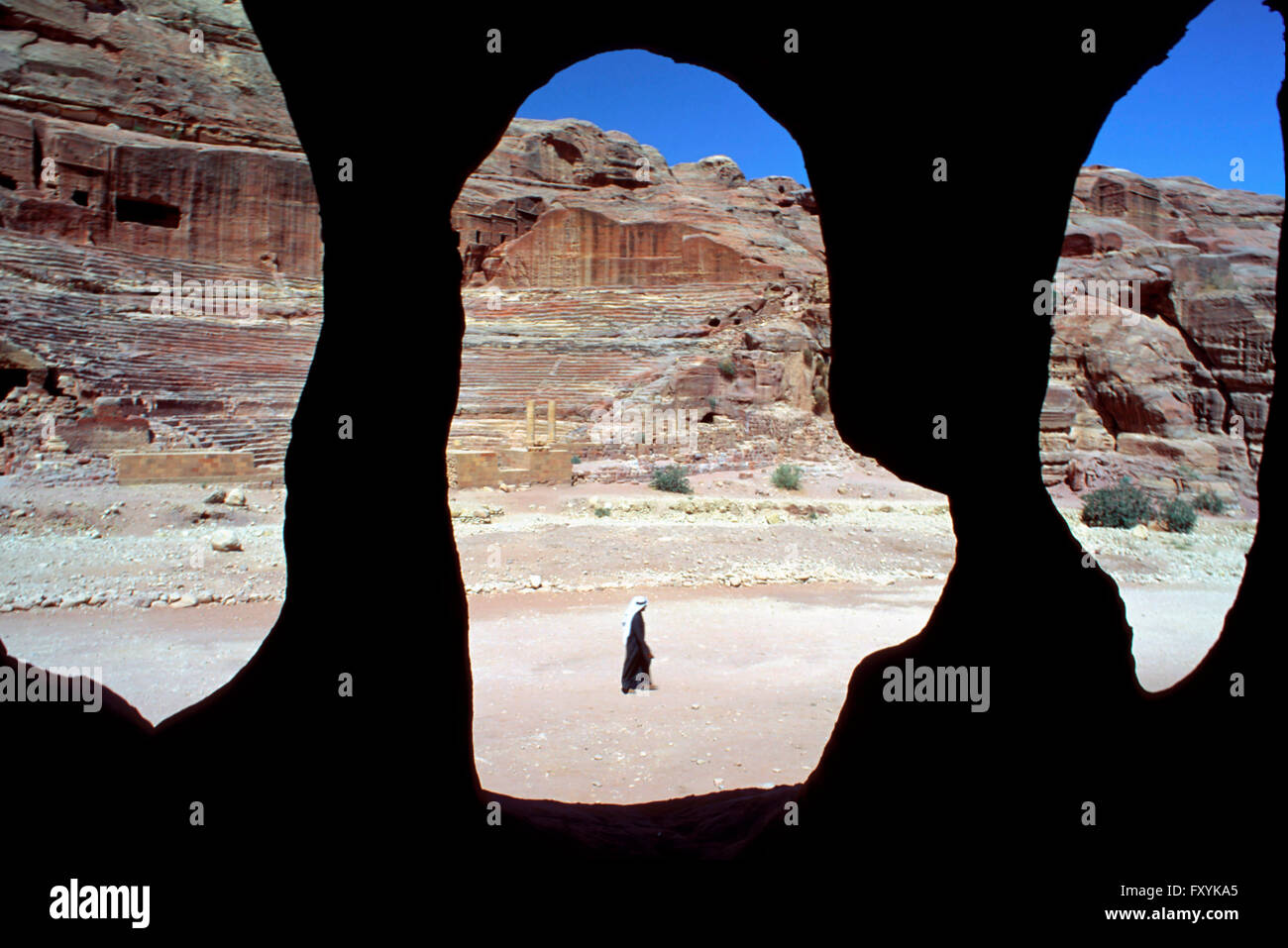 Cave With Roman Amphitheatre In The Background, Petra, Jordan Stock ...