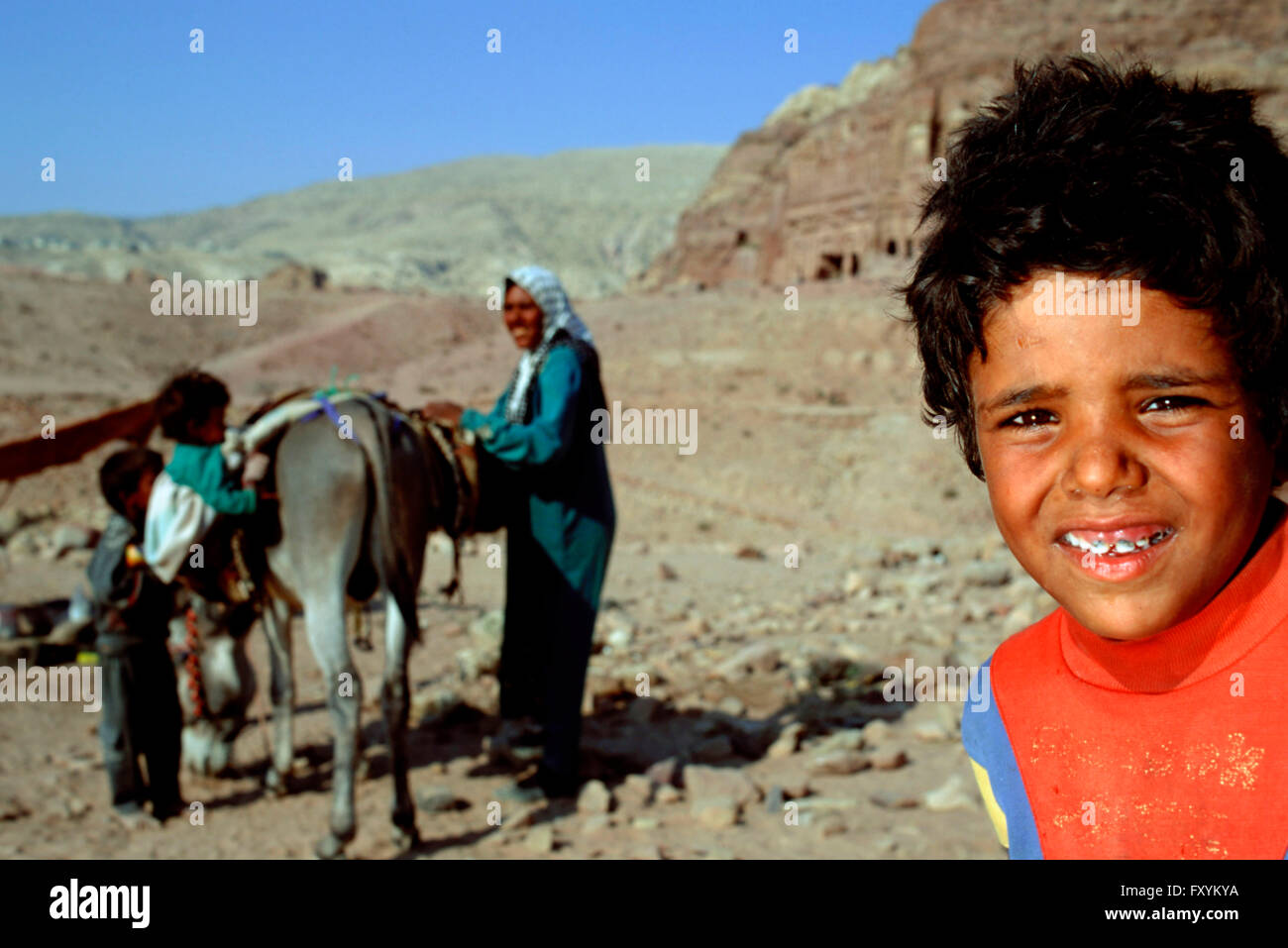 Bedouin family with a donkey returning home after a day's work Stock ...