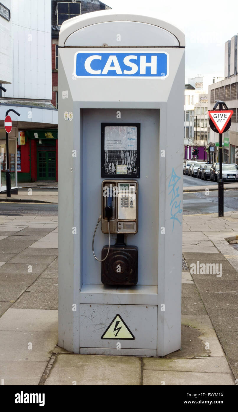 A phone box has two use as a public phone and as a cash dispensing ...