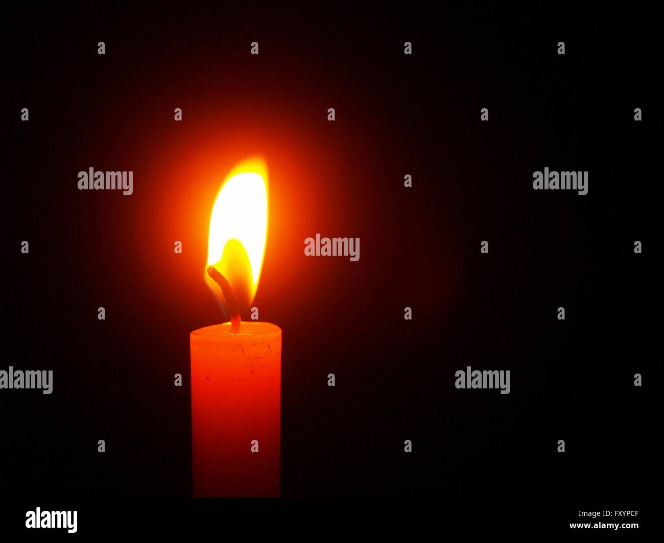 candle burning brightly Stock Photo - Alamy