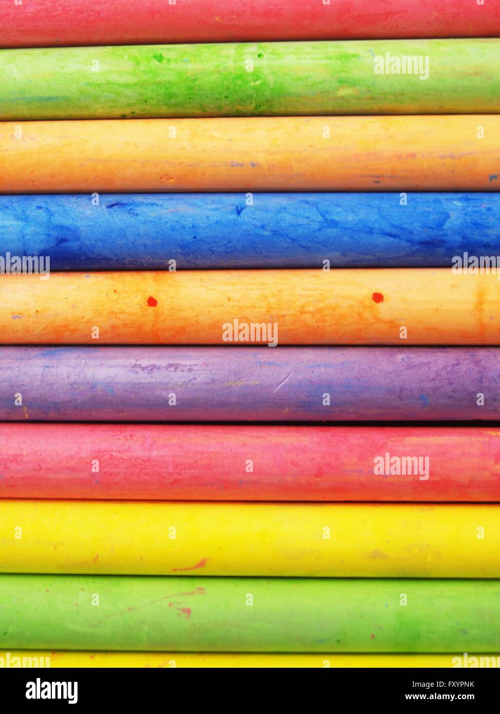 Colored chalk on a blackboard background Stock Photo - Alamy