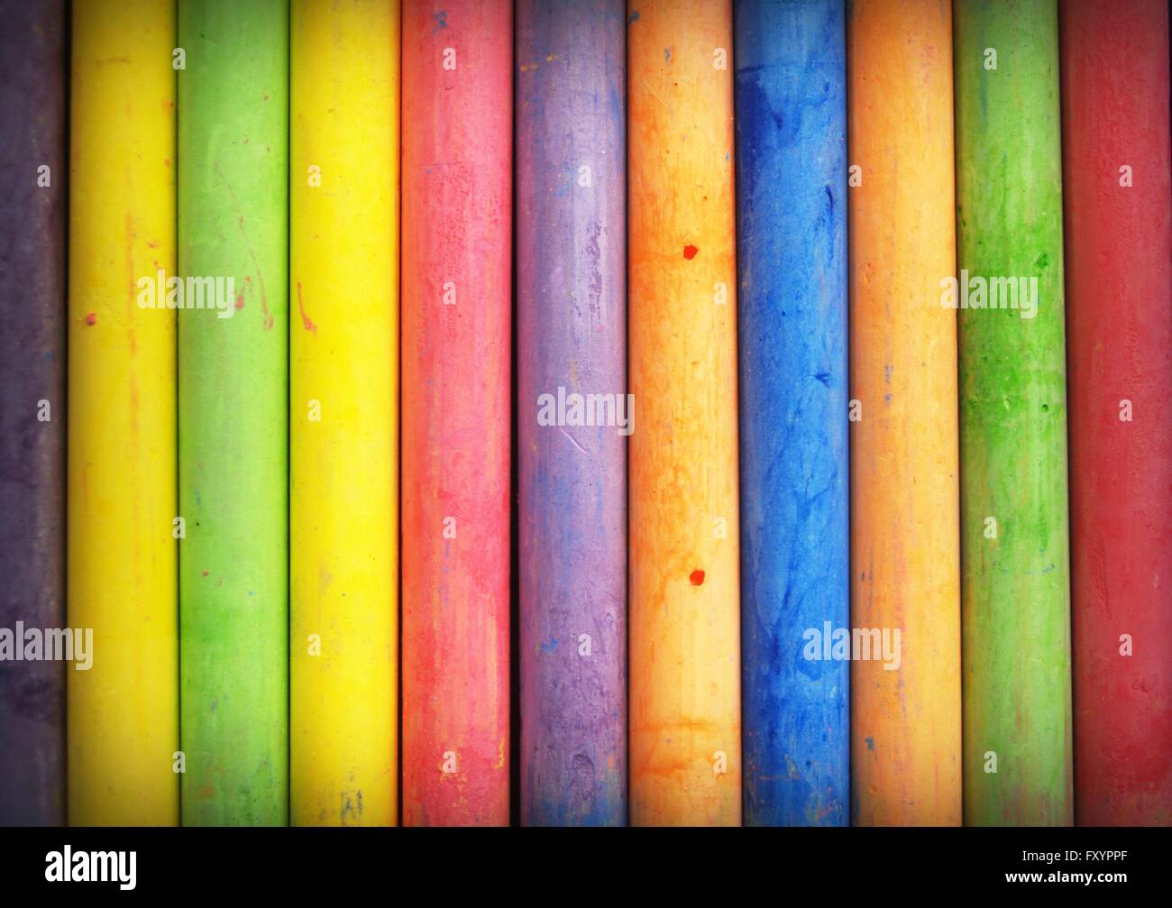 Colored chalk on a blackboard background Stock Photo - Alamy