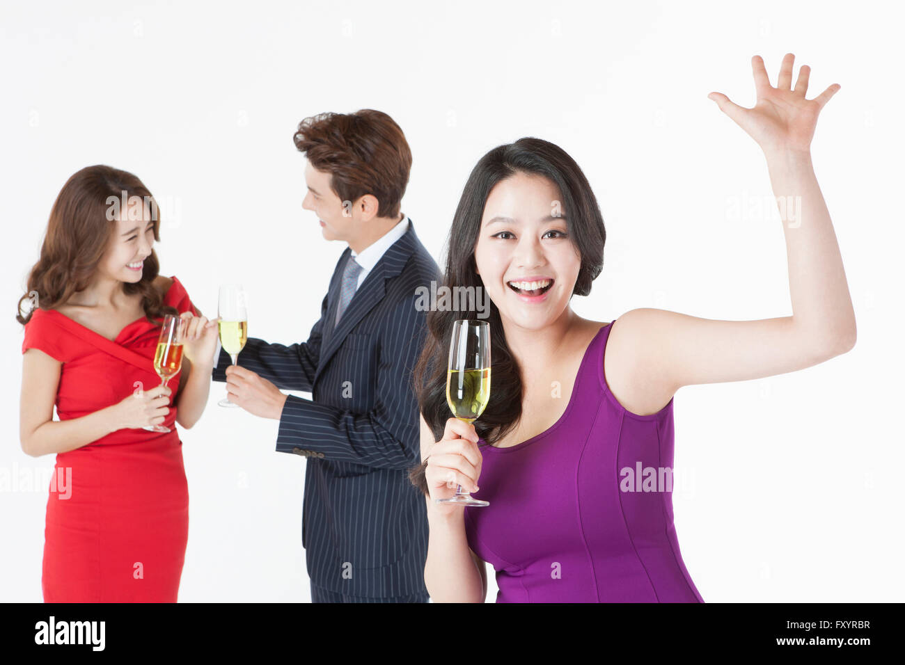 Portrait of three young smiling people at party Stock Photo - Alamy