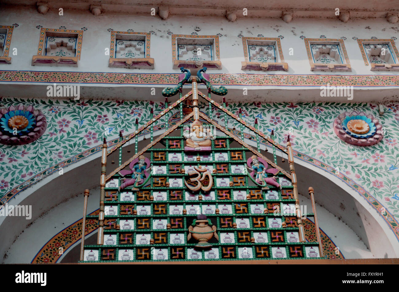 Detail above an entrance gate to the City Palace Museum in Udaipur ...