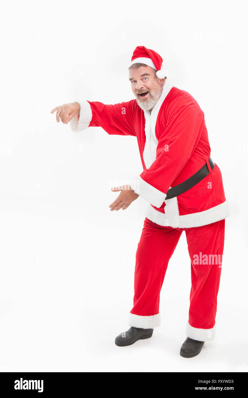 Smiling Santa standing holding his hands staring at front Stock Photo ...